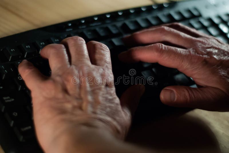 Hands Typing on a Computer Keyboard with a Mouse, Close-up in Front of ...