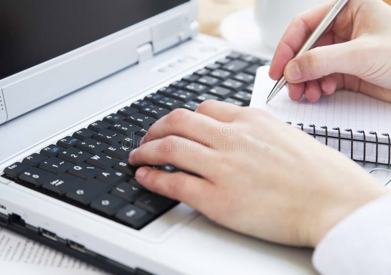 Hands Typing on Computer Keyboard and Taking Notes at Office Stock ...