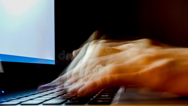 Hands Typing Fast on a Laptop Keyboard. Home Office Late at Night in ...