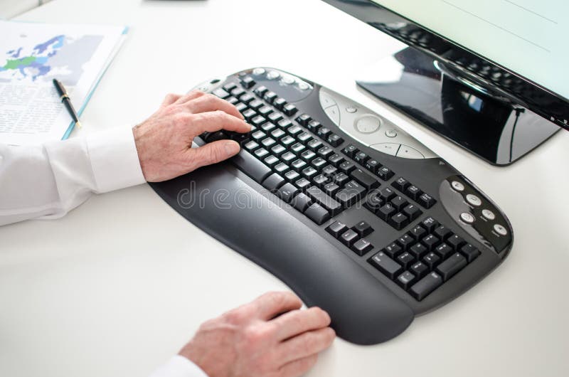 Hands Typing on a Keyboard and Using a Computer Mouse Stock Image ...