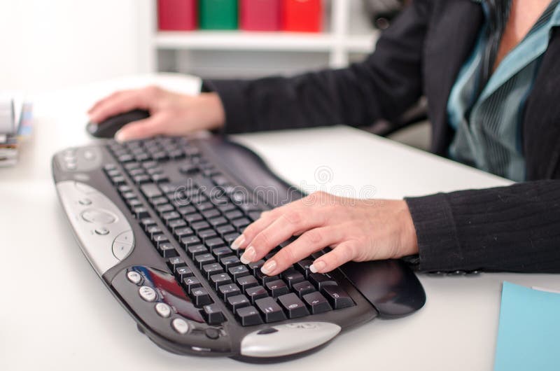 Hands Typing on a Keyboard and Using a Computer Mouse Stock Image ...