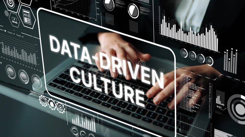 Hands Typing on Laptop with Data-Driven Culture Text Surrounded by Digital Graphs and Charts in ...