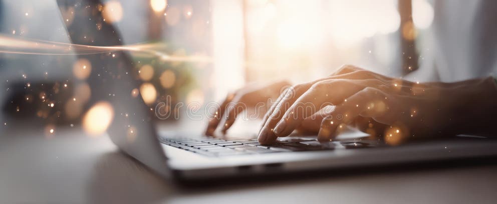 The Hands Typing on a Laptop in a Modern Workspace with Glowing Lights ...