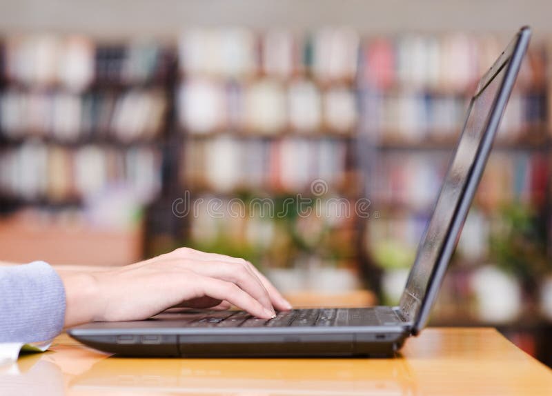 Hands Typing on Notebook in Library Stock Image - Image of internet ...