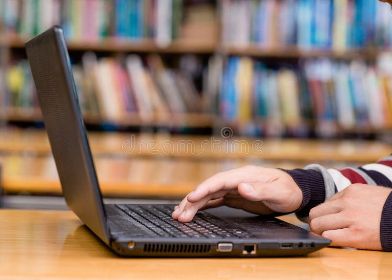 Hands Typing on Notebook in Library Stock Photo - Image of modern ...