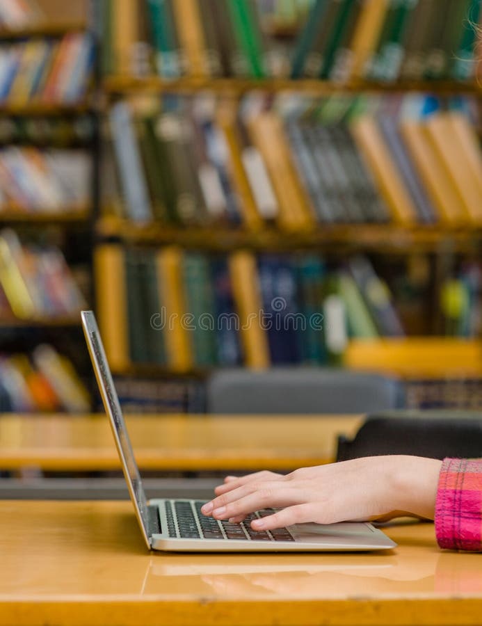 Hands Typing on Notebook in Library Stock Image - Image of college ...