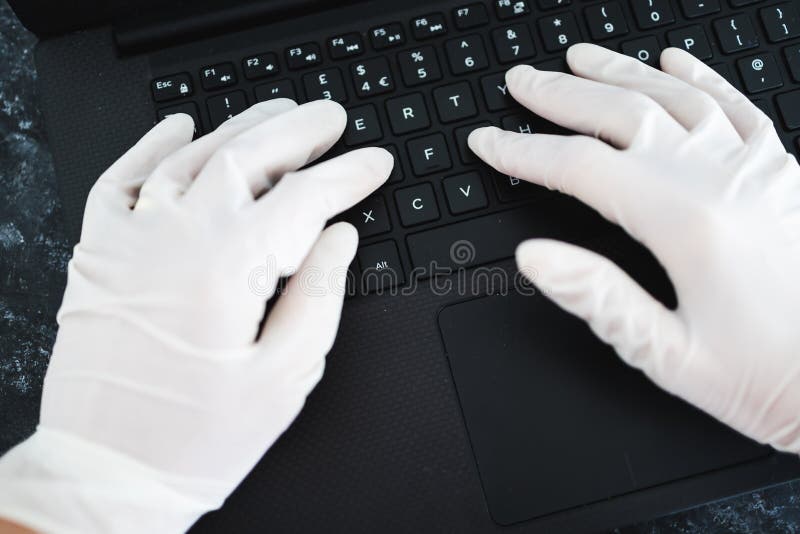 Hand Typing on Shared Computer Keyboard at Work Wearing Disposable ...