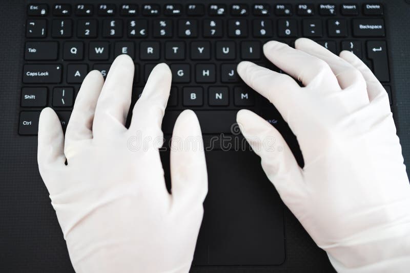 Hand Typing on Shared Computer Keyboard at Work Wearing Disposable ...