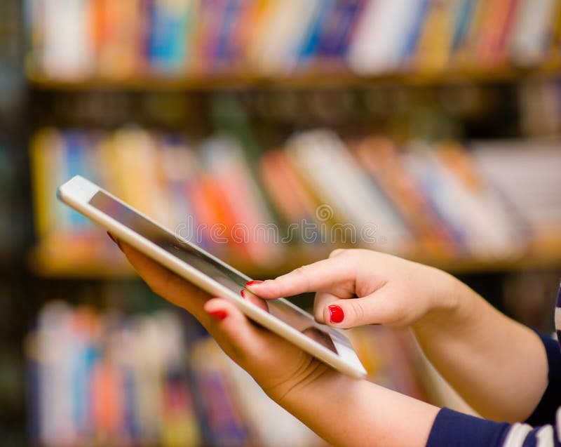 Hands Typing on Tablet Computer in Library Stock Photo - Image of hand ...