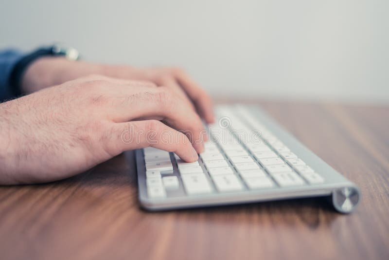 Hands Typing on Wireless Keyboard on Wooden Table Stock Image - Image ...