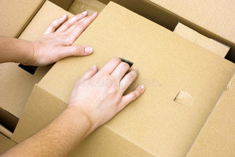 Hands Unpacking Cardboard Box Stock Image - Image of packaging ...