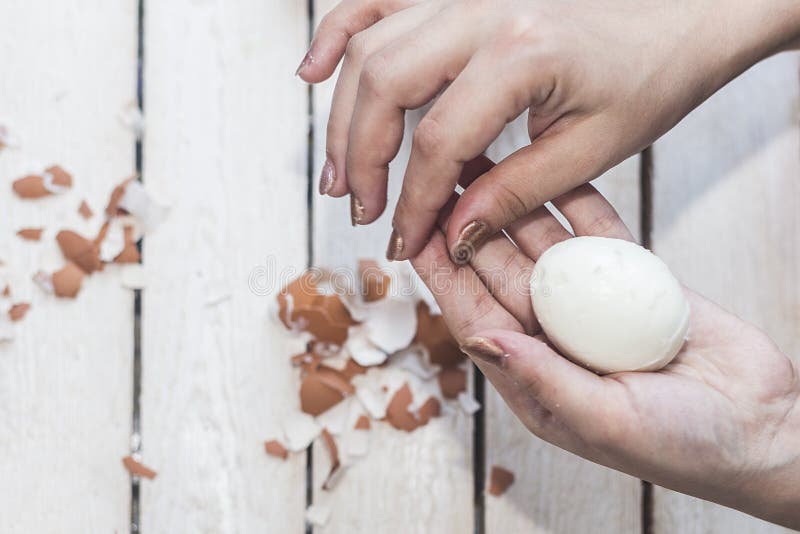 Woman Cleaning Boiled Eggs from the Shell Stock Photo - Image of cooked ...