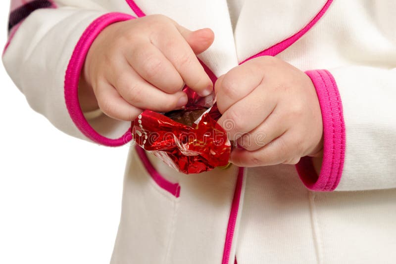 Hands unwrapping candy stock photo. Image of closeup - 47941884