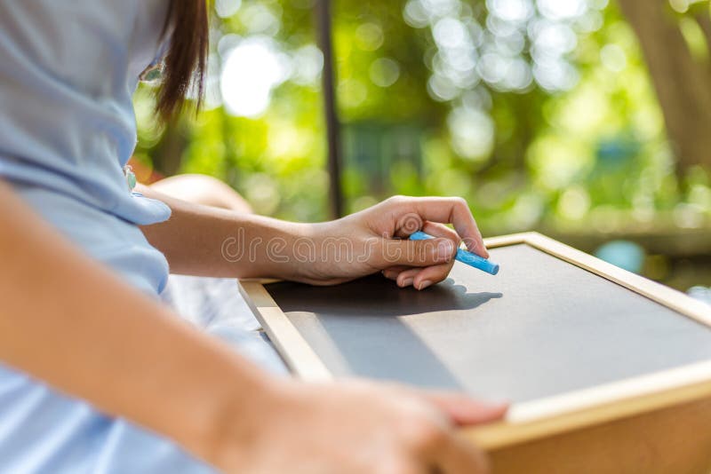 Hands Use Chalk for Drawing, Writing Balckboard in the Parks. Education ...