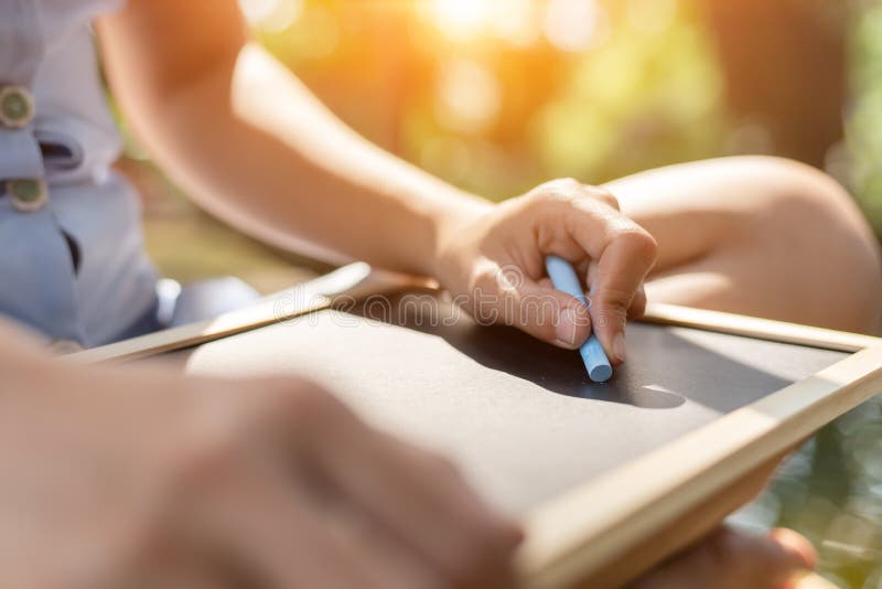 Hands Use Chalk for Drawing, Writing Balckboard in the Parks. Education ...