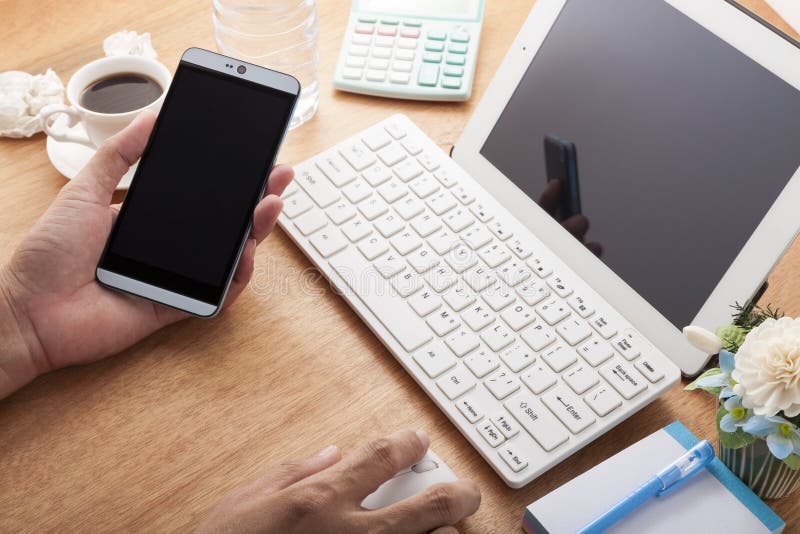 Hands Using Cell Phone and Laptop on Desk Wood and Business Work Stock ...