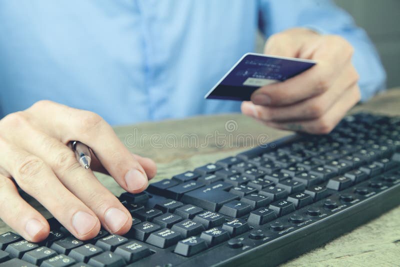 Hands Using Computer and Holding Credit Card Stock Image - Image of ...