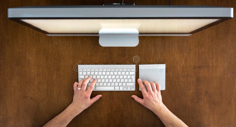 Hands Using a Computer while Sitting at the Table, Top View. Stock ...