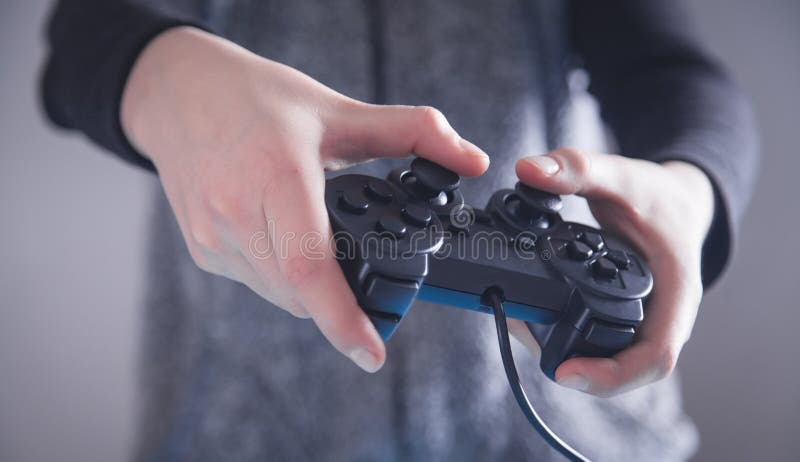 Hands Using Game Controller. Playing Video Games Stock Photo - Image of ...