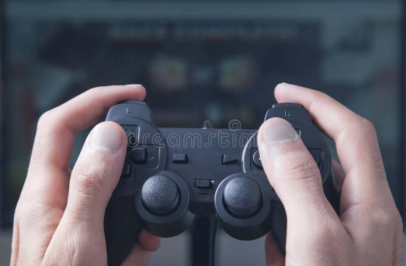 Hands Using Joystick. Playing Video Game on Computer Monitor Stock ...