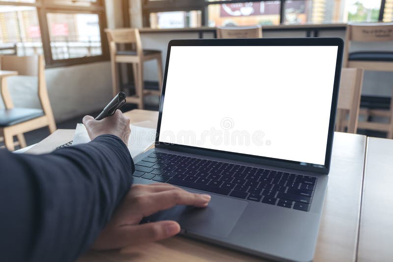 Hands Using Laptop with Blank White Desktop Screen while Writing on a ...