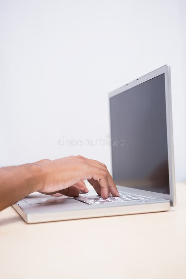 Hands using laptop at desk stock image. Image of closeup - 57308521
