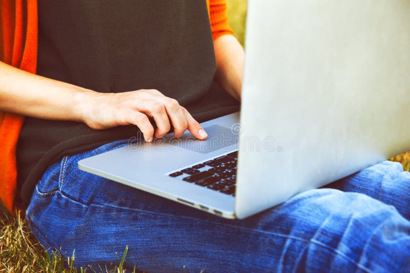 Hands using laptop typing stock photo. Image of park - 56582758