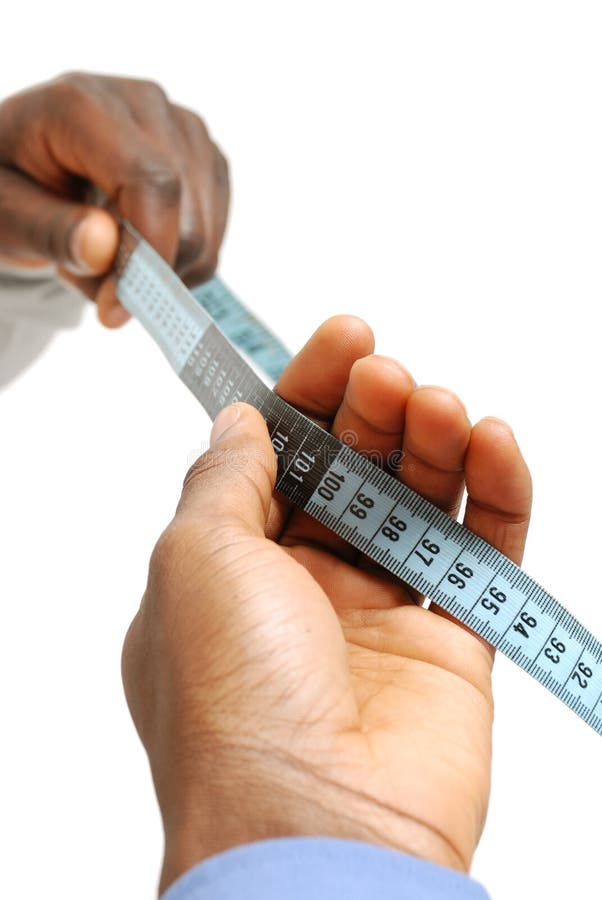 Hands using measuring tape stock photo. Image of african - 14680336