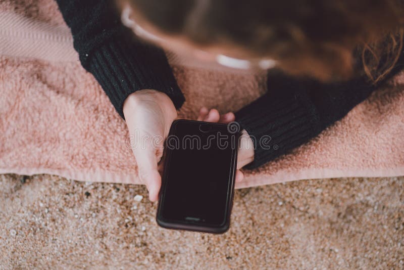 Hands Using a Mobile Phone on a Towel in the Beach Stock Image - Image ...