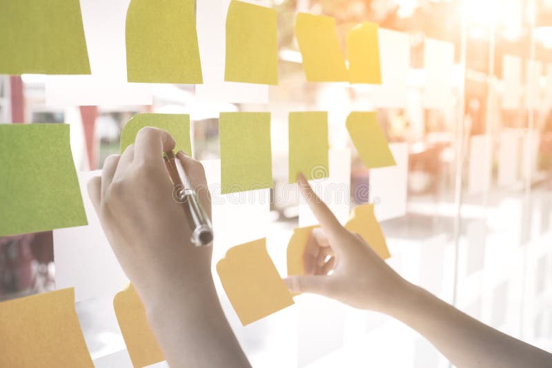 Hands Using Post it Paper Note To Memo or Share Ideas. Stock Photo ...