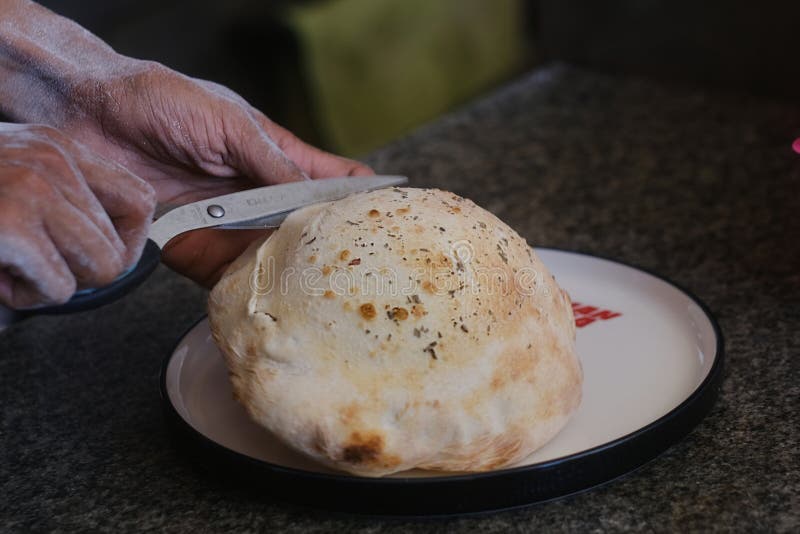 Hands Cutting Bread Lid from Bread Bowl with Scissors Stock Photo ...
