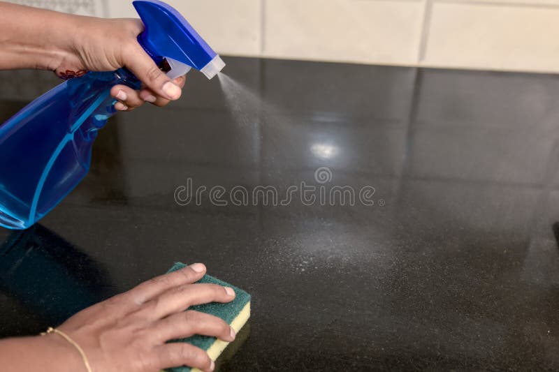 Kitchen Counter Cleaning stock image. Image of kitchen - 335561443