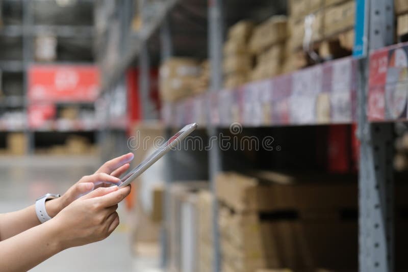 Hands Using Tablet at Goods Shelf of Store Warehouse Stock Photo ...