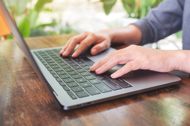 Hands Using and Typing on Laptop Computer Keyboard on the Table Stock ...