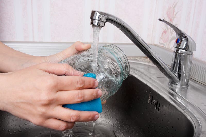 Hands washing glass jar stock image. Image of female - 68851385