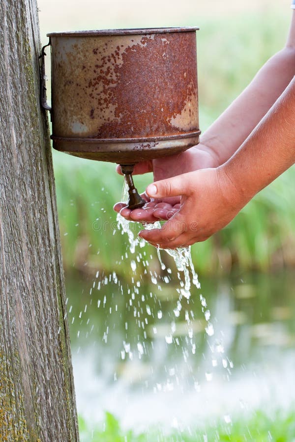 Hands washing outdoors stock photo. Image of splash, wash - 26534918