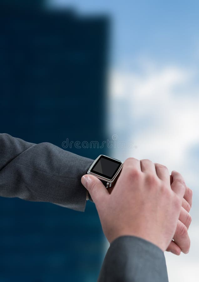 Hands with Watch Against Blurry Building Stock Image - Image of ...
