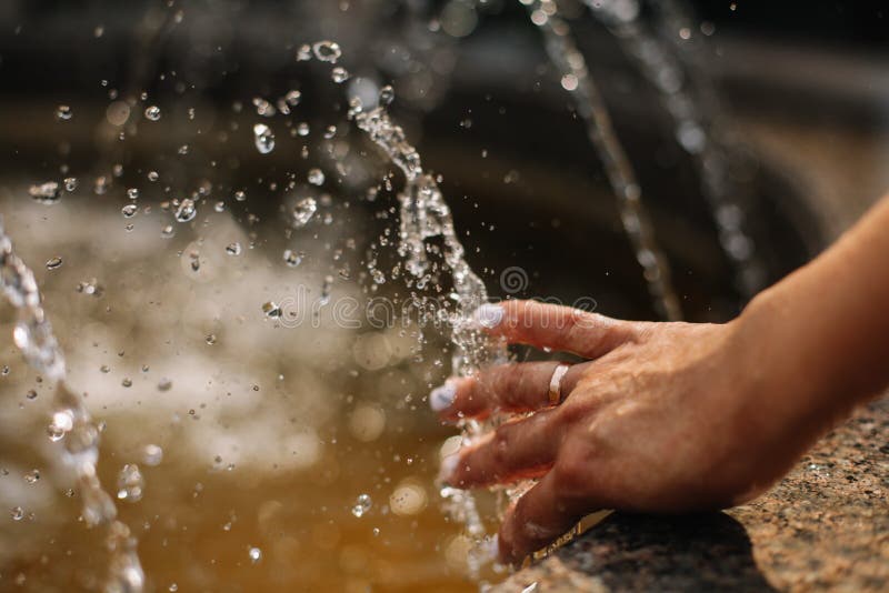 Hands with water splash. stock photo. Image of body - 180456864