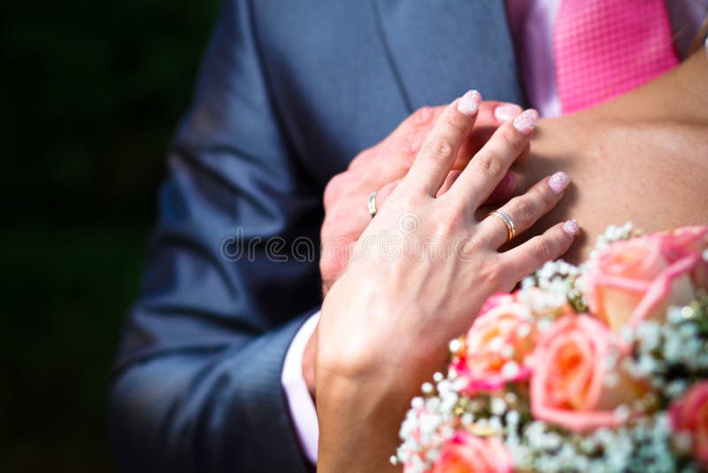 Hands with Wedding Ring on Brides Shoulder Stock Image - Image of ...