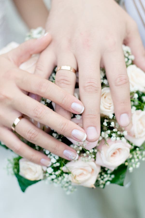 Hands with wedding rings stock photo. Image of blossom - 4014818