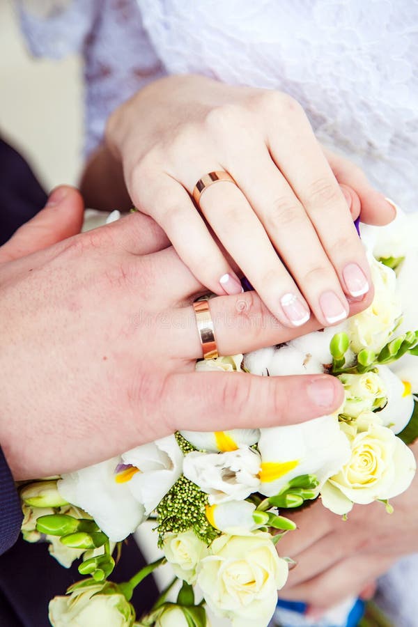 Hands with Wedding Rings and Bouquet Stock Image - Image of cheerful ...