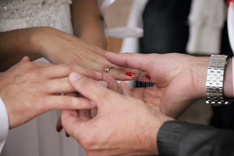 Hands and wedding rings stock image. Image of custom - 45141659