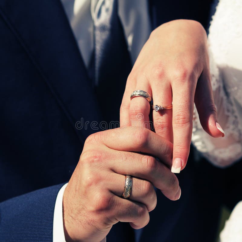 Hands with wedding rings stock image. Image of marriage - 99312379
