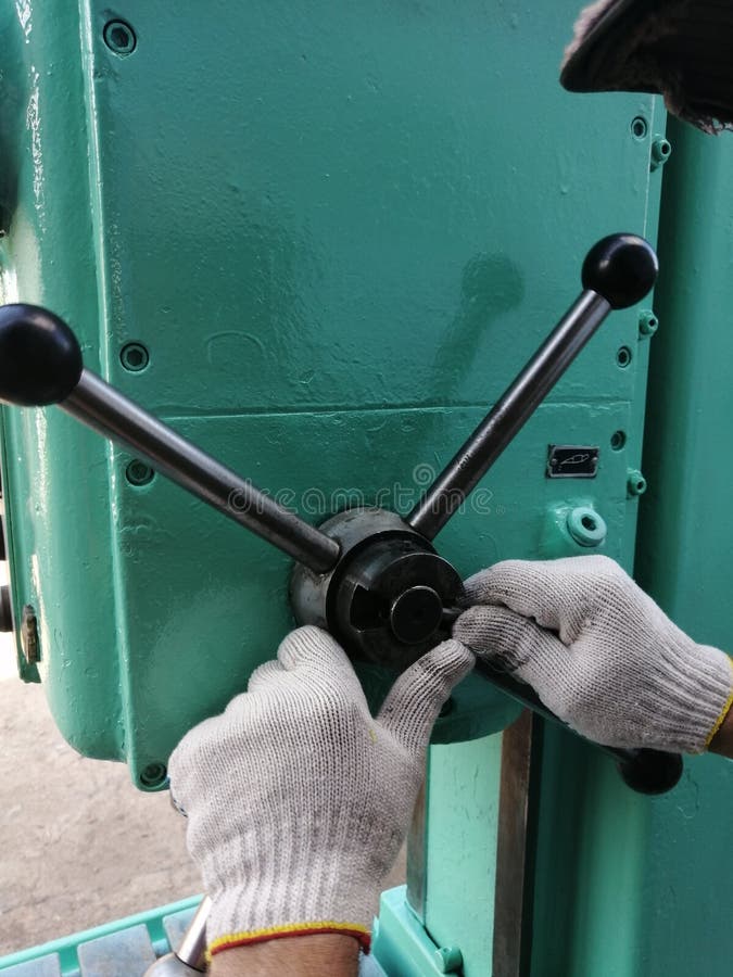 Hands in White Gloves Hold the Lever of the Drilling Machine Stock ...