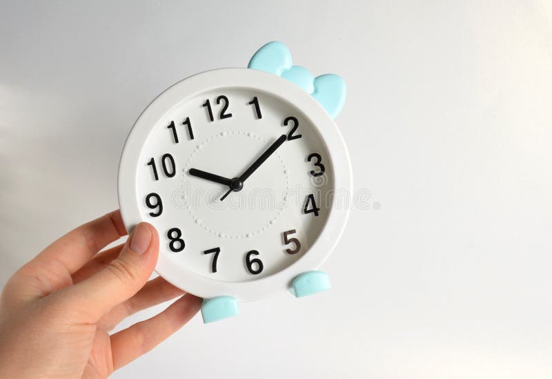 In Hands White Watch with a Blue Bow on a White Background. Stock Photo ...