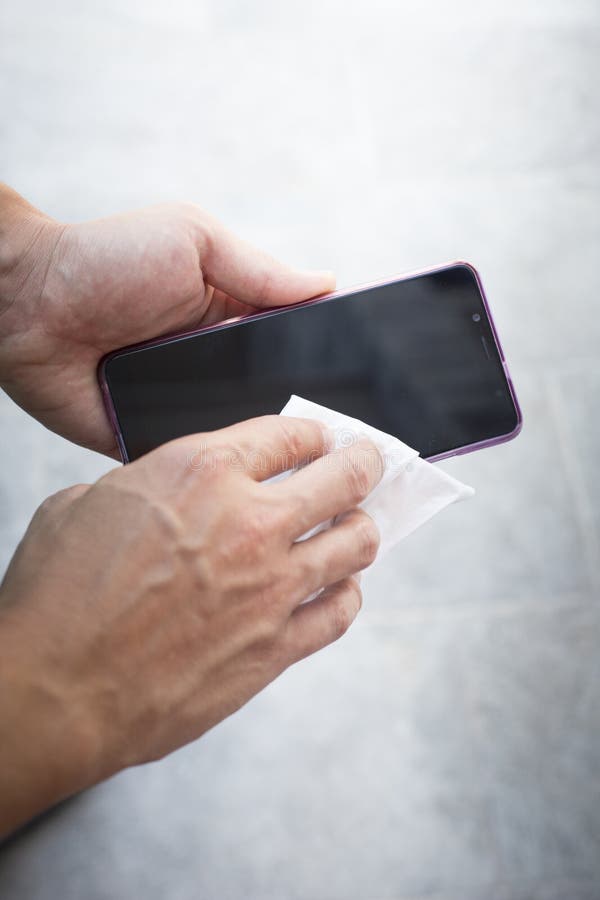 Hands Wiping Smartphone Screen. Vertical Shot Stock Photo - Image of ...