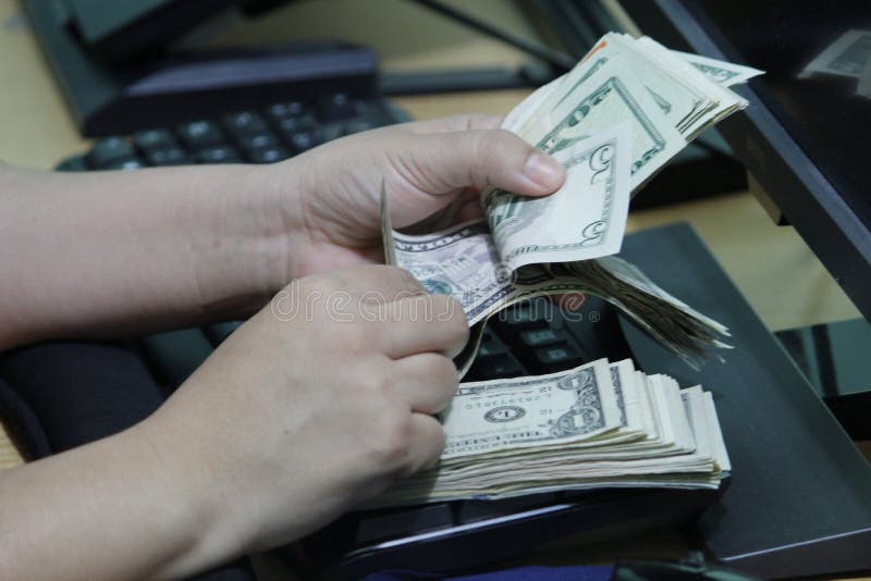 Hands of a Woman Counting American Money on a Computer Keyboard Stock ...