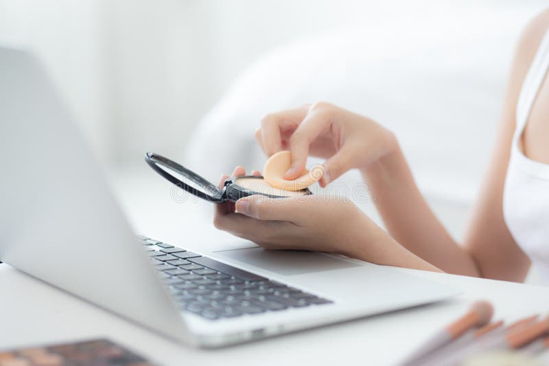 Hands of Woman with Learning Makeup with Powder Puff on Cheek Watching ...