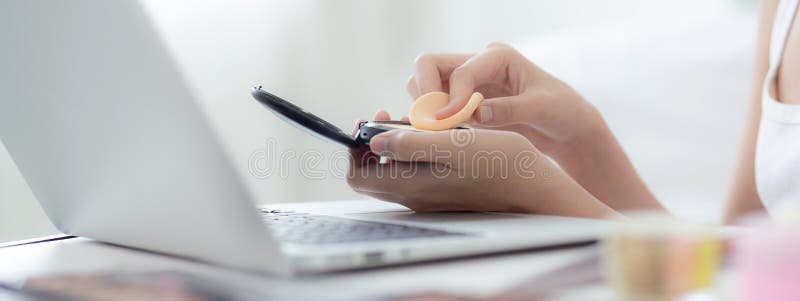 Hands of Woman with Learning Makeup with Powder Puff on Cheek Watching ...