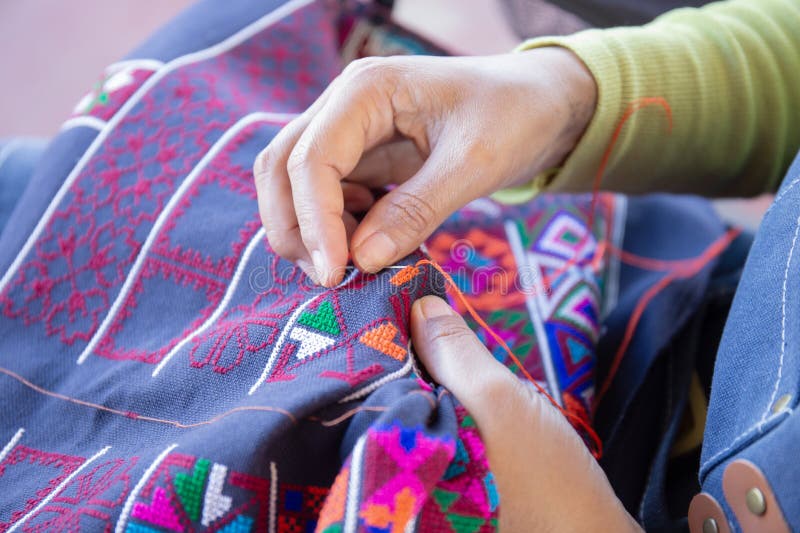 Hands of a Woman Sewing Decorate Fabric with Orange Thread Stock Image ...